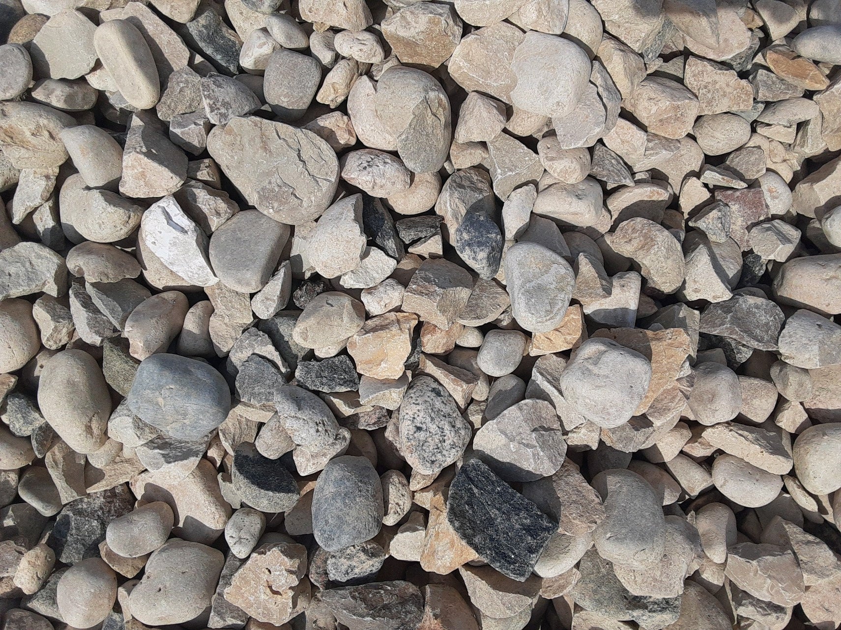 Economy River Rock | Bags and Bulk Landscape Supply Yard